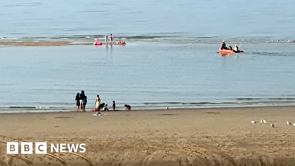 Rhyl beach: Lifeboat rescues people cut off by tide