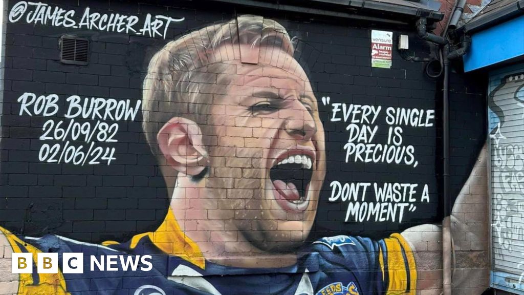 Rob Burrow mural painted to show 'all his glory' - BBC News