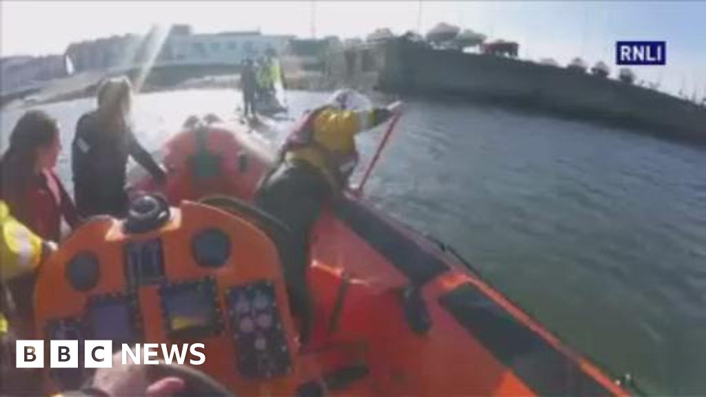 Two young paddle boarders rescued in Bangor - BBC News