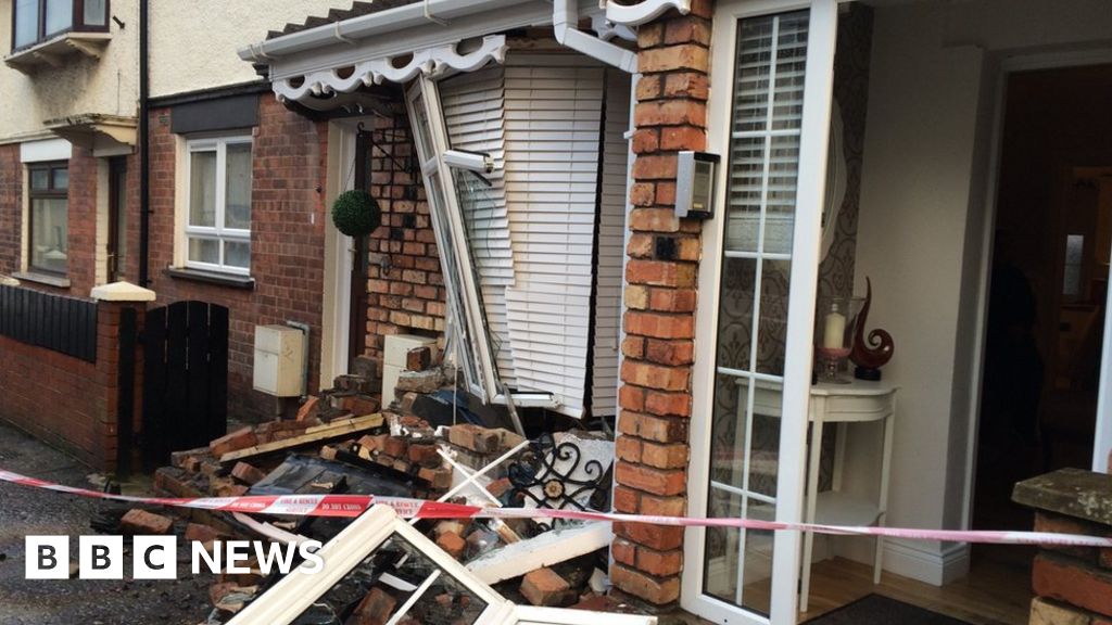 Stolen car crashes into Belfast house - BBC News
