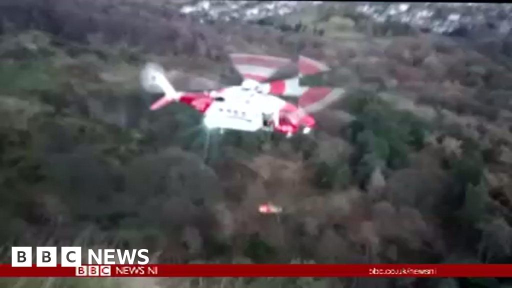 Cavehill: Dramatic footage shows cliff rescue - BBC News