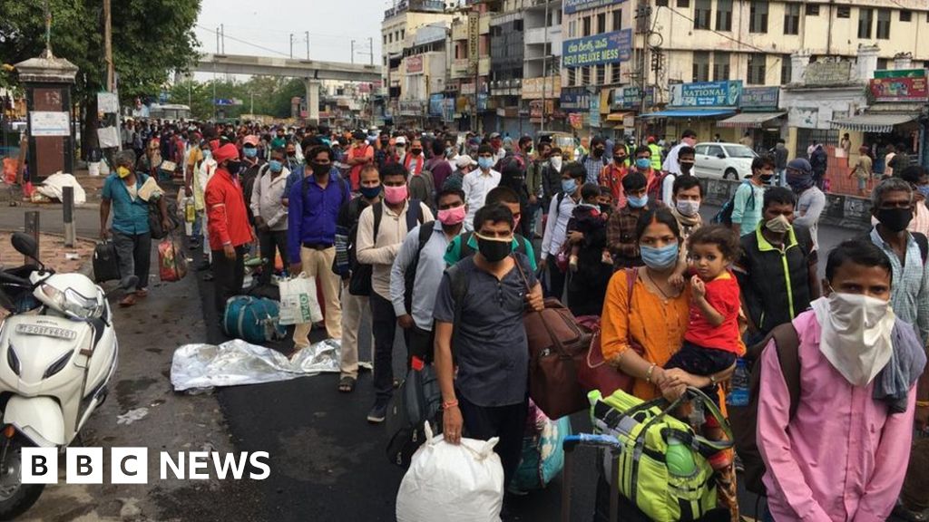 India coronavirus: Huge crowds as some train services resume - BBC News