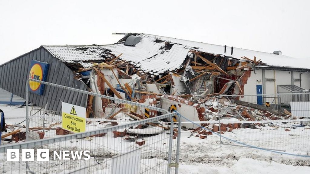 Charges after Dublin shop is 'looted and bulldozed' - BBC News