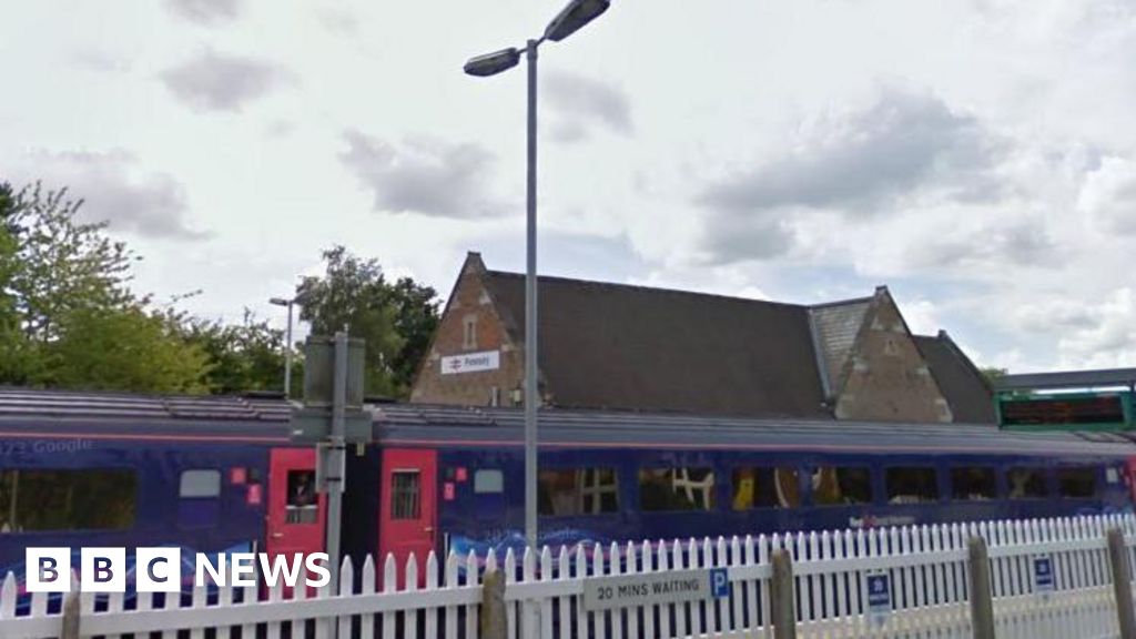 Fire by railway tracks causes disruption to services - BBC News