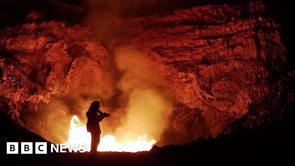 The photographer who lowers herself into active volcanoes - BBC News
