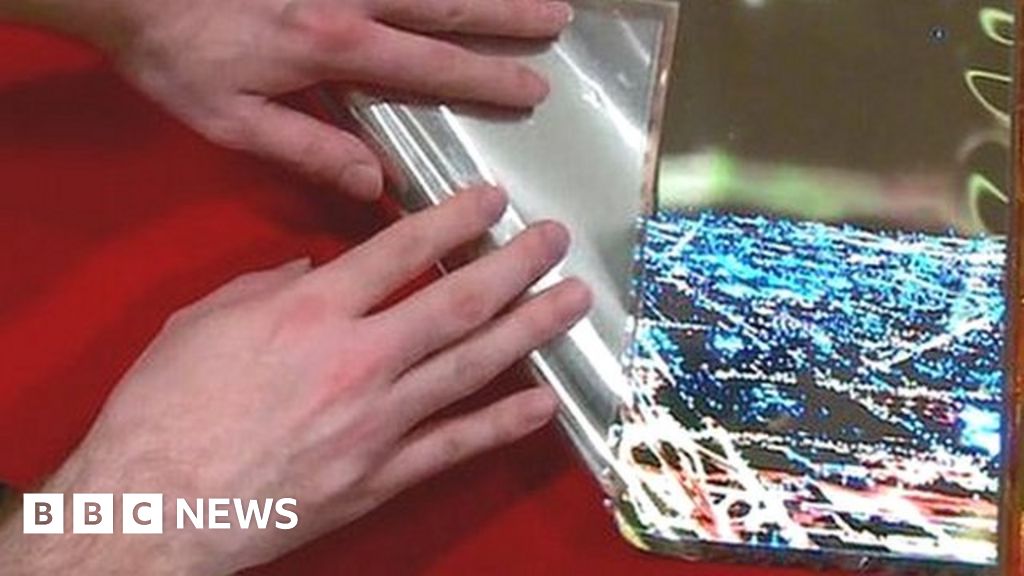 CES: 2016 Hands-on with LG's bendy roll-up OLED screen - BBC News