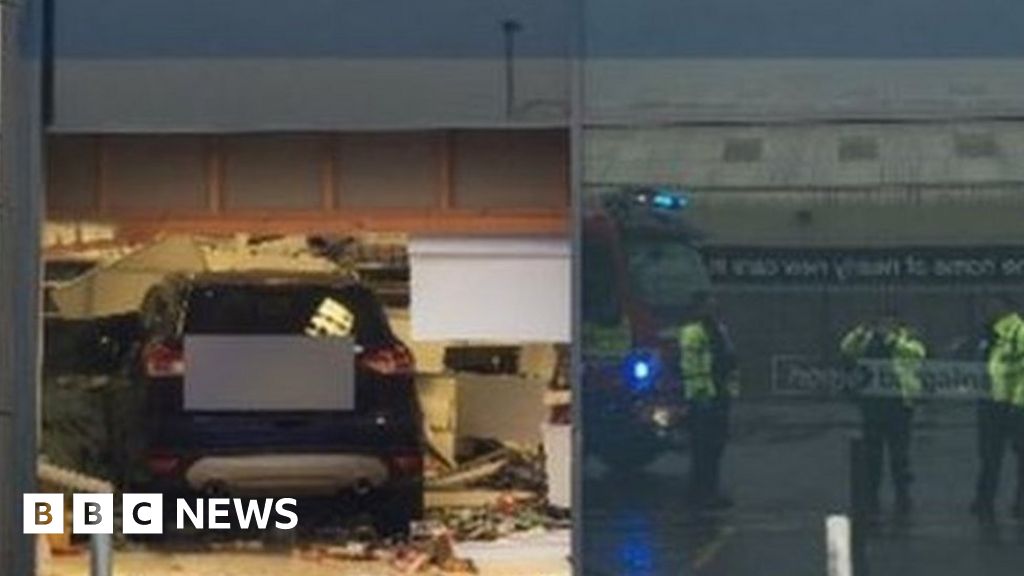 Car crashes through Home Bargains window in Cross Hands - BBC News