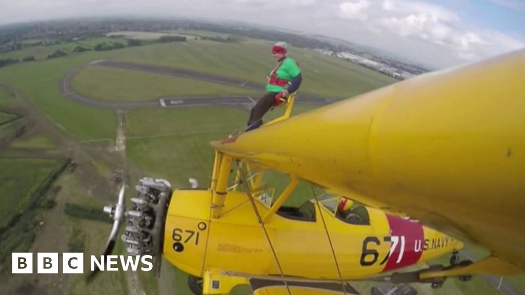 Wing walk plane sailing for first-time flyer - BBC News