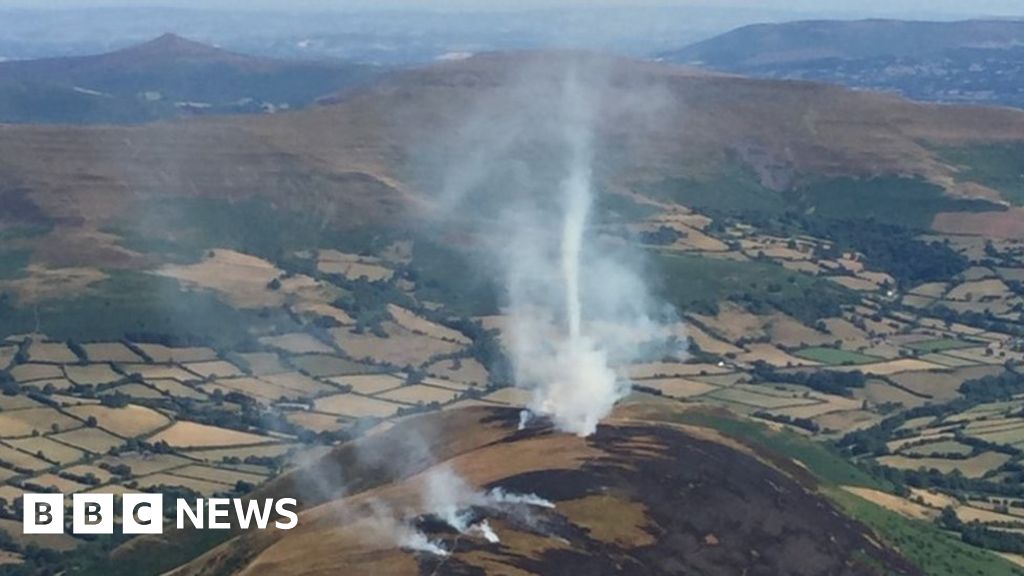 Water warning as wildfires keep burning across Wales - BBC News