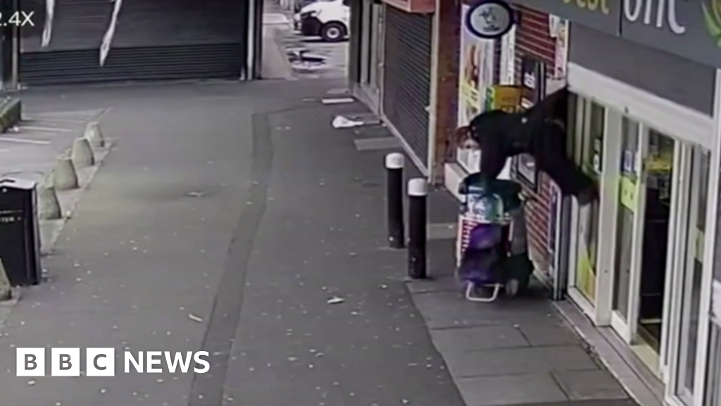 TikTok viral cleaner hoisted in air by shop shutters remembered - BBC News