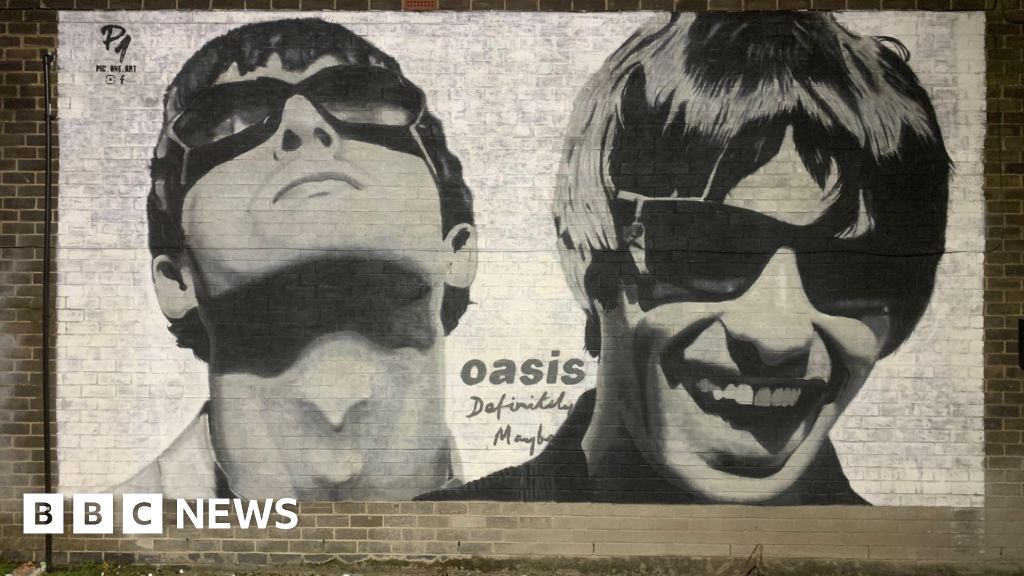 Mural appears on Manchester record shop featured in Oasis track - BBC News