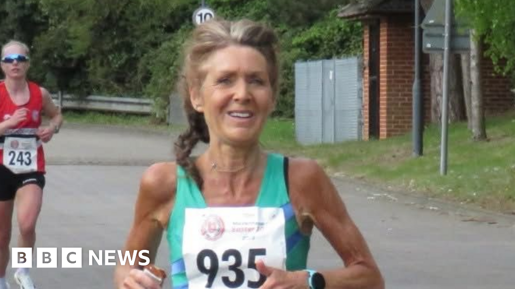 Runner, 61, beats record after 14-year break from sport - BBC News