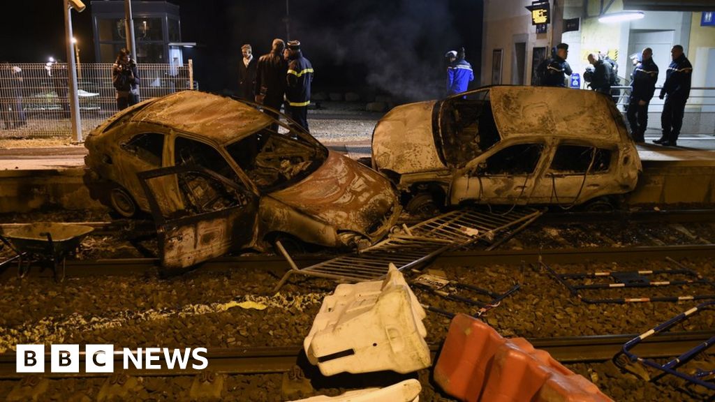 France PM Valls promises crackdown after cars burned in riot - BBC News