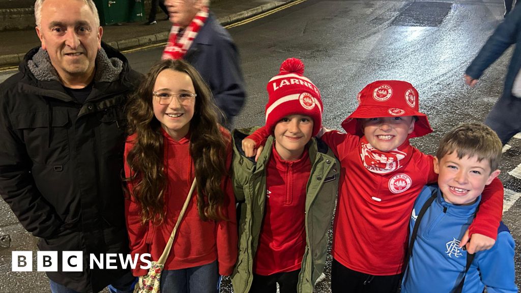 Larne fans 'over the moon' as 10-man team makes history - BBC News