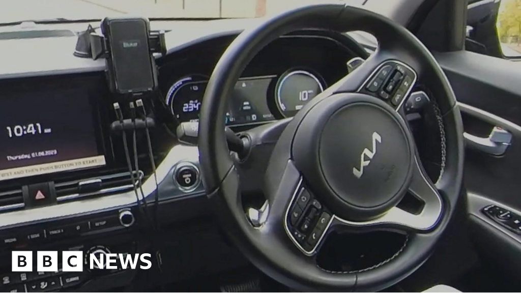 Watch a remotely driven hire car in action in Milton Keynes - BBC News