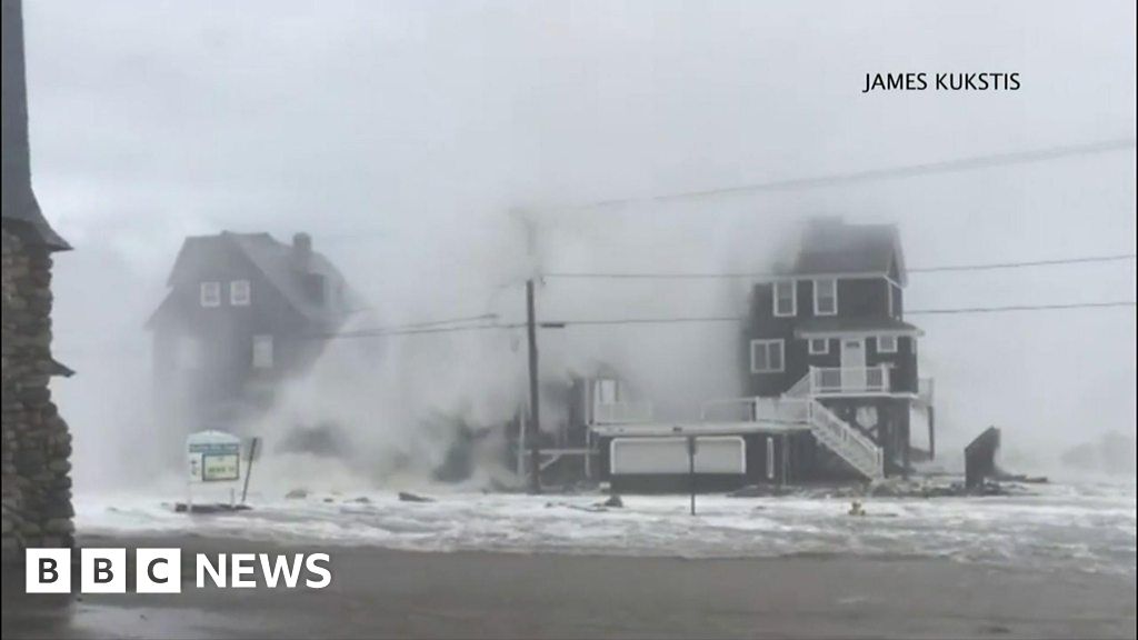 Towering waves crash over Massachusetts homes in storm - BBC News