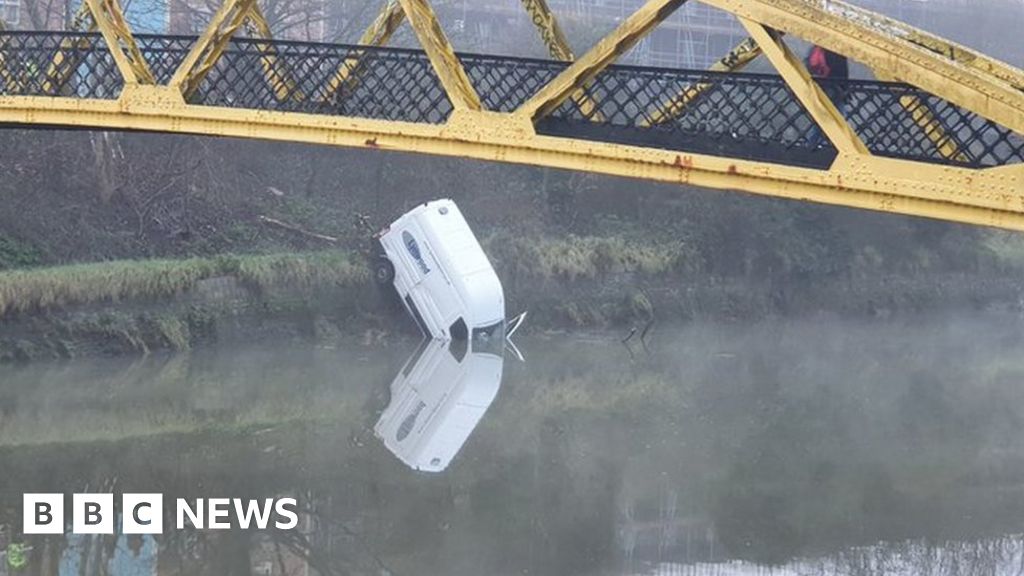 Lucky escape for driver as van crashes into River Avon - BBC News