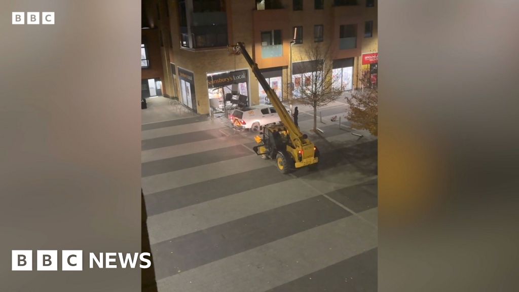 Gang uses telehandler to rip cash machine from local shop - BBC News