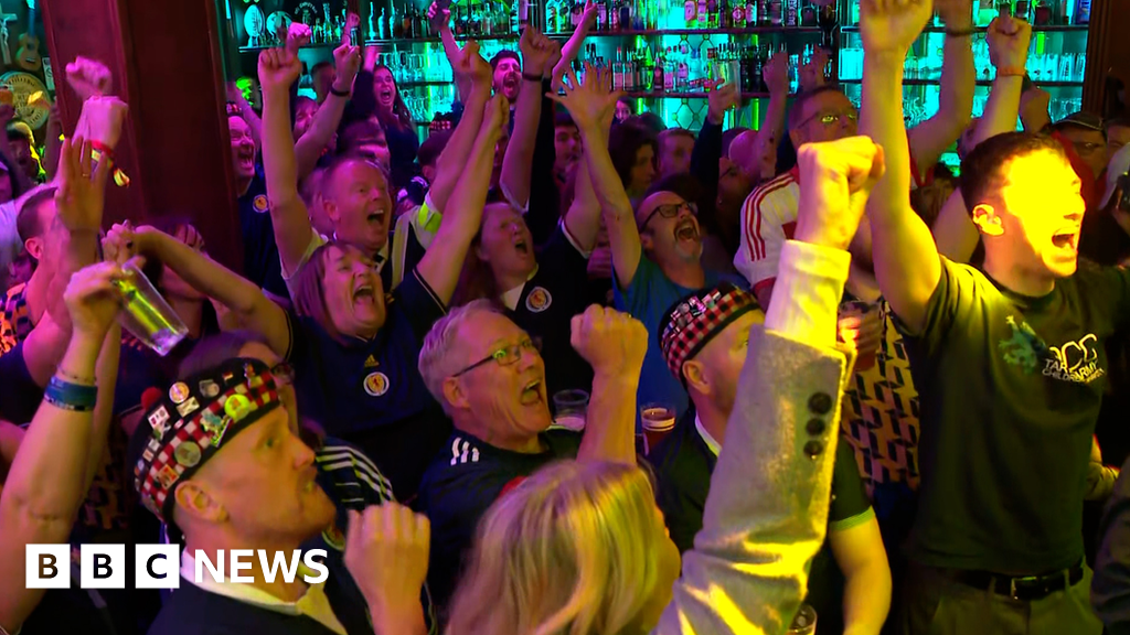 Scotland fans celebrate qualifying for Euros - BBC News