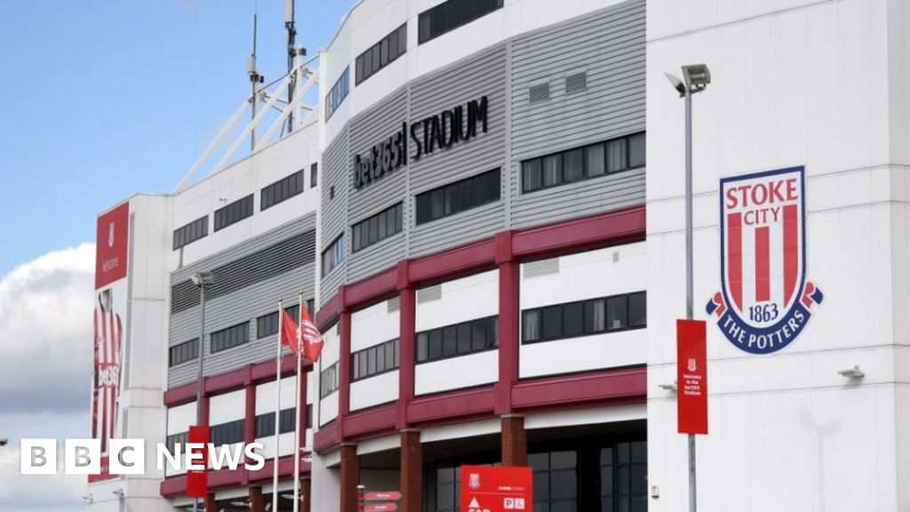 Stoke fan gets lifetime ban after sons run on pitch - BBC News