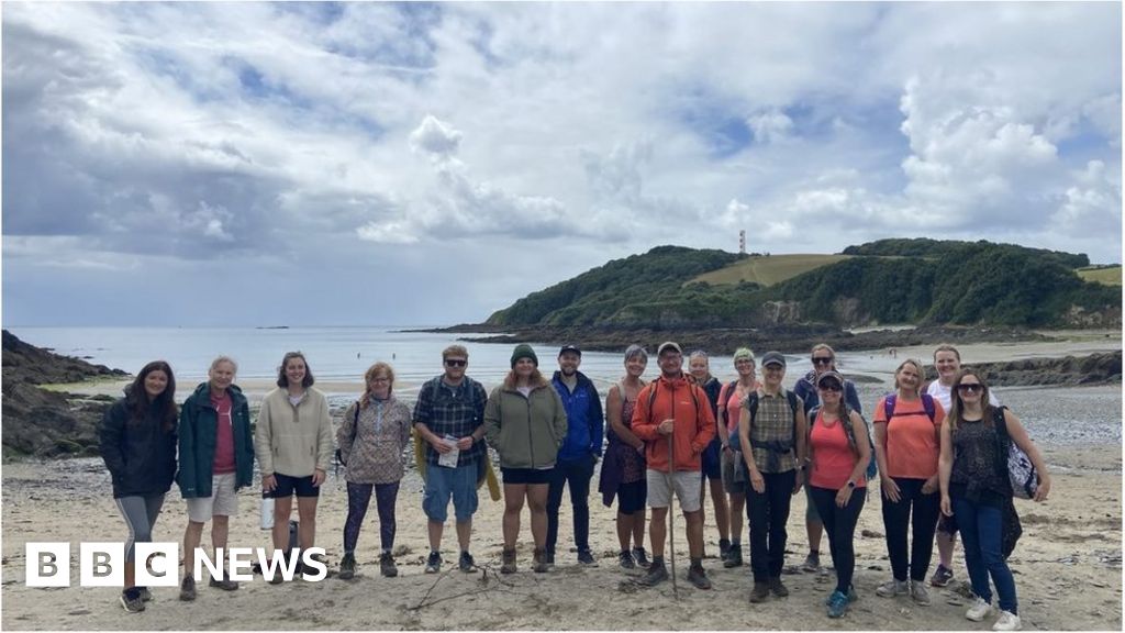NHS staff mark 75 years milestone with coastal walk - BBC News