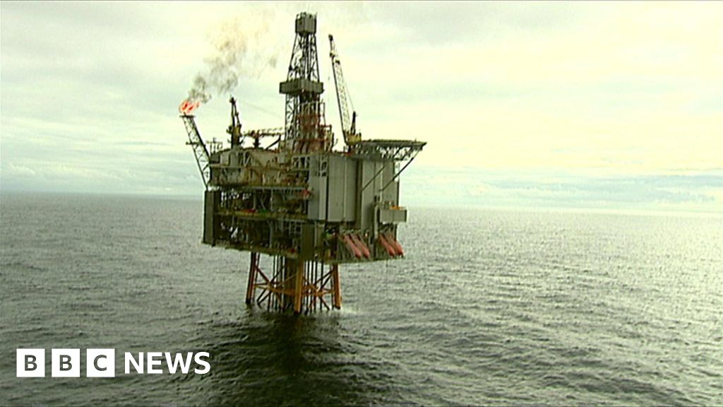 BP shares slide 9% as profits halve - BBC News