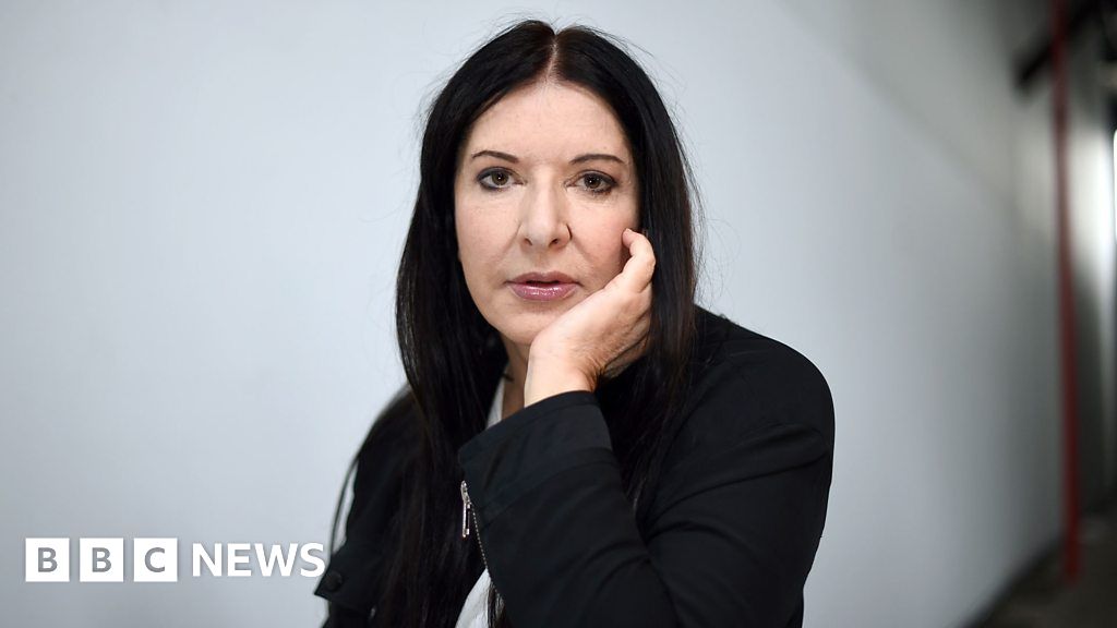 Why is the performance artist being accused of Satanism? - BBC News