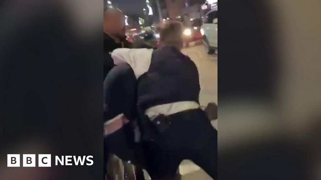 Officer 'punch' caught on camera - BBC News