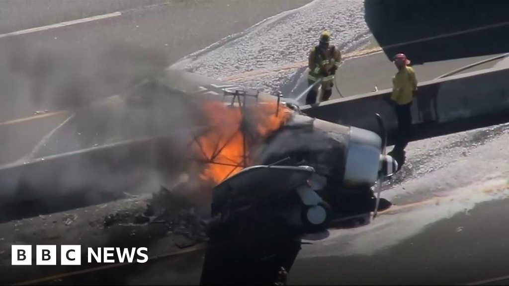 Plane bursts into flames on US motorway