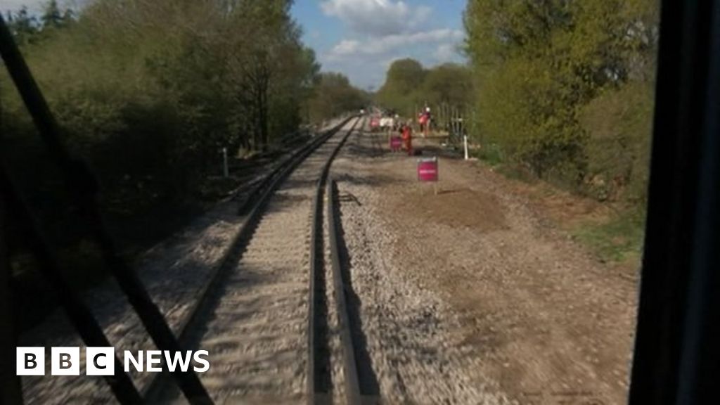 Farnham to Alton rail line reopens after landslip - BBC News