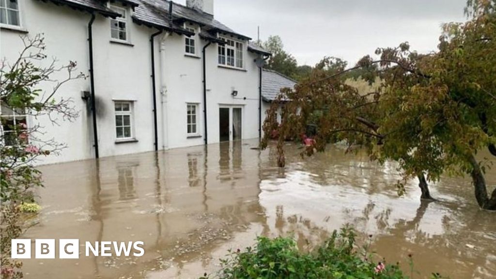 Homes cut off by flooding after heavy rain hits Wales