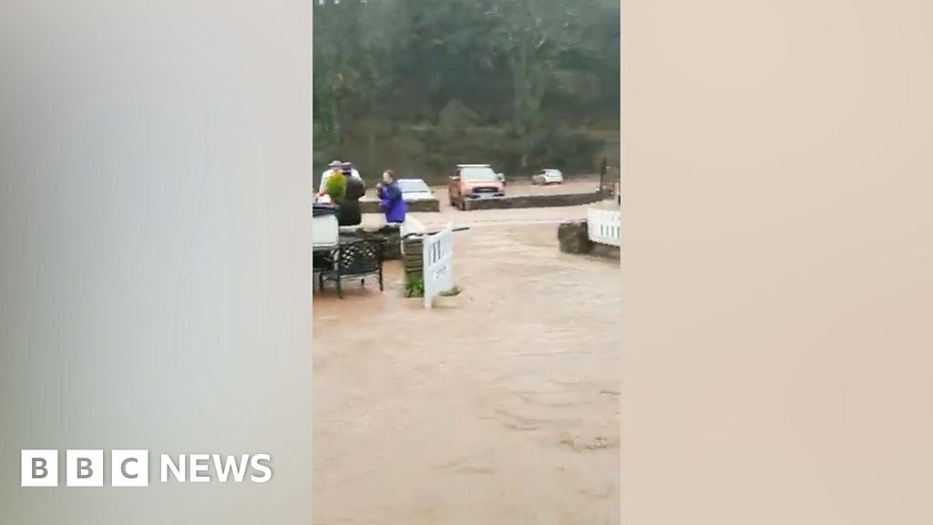Pubs flooded as rivers burst banks in north Devon - BBC News