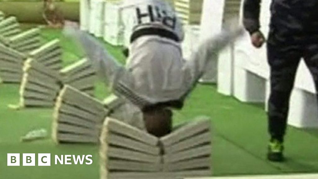 Bosnian man crushes concrete blocks with head - BBC News