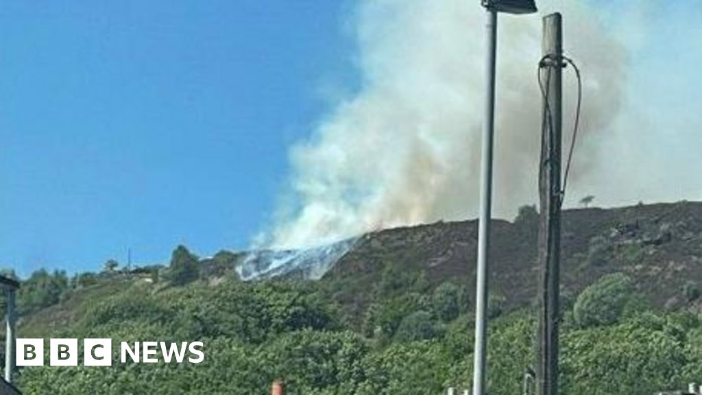 Bury moorland blaze extinguished by firefighters - BBC News