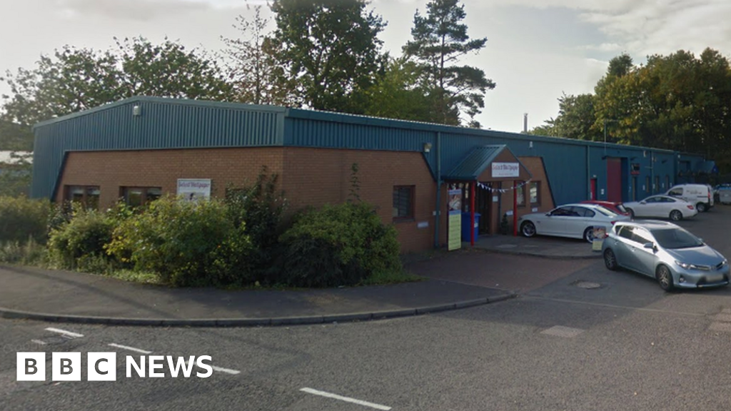 Man arrested over wallpaper shop stabbing