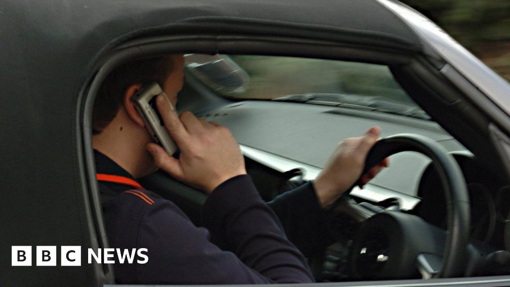 Police crackdown on use of mobiles when driving - BBC News