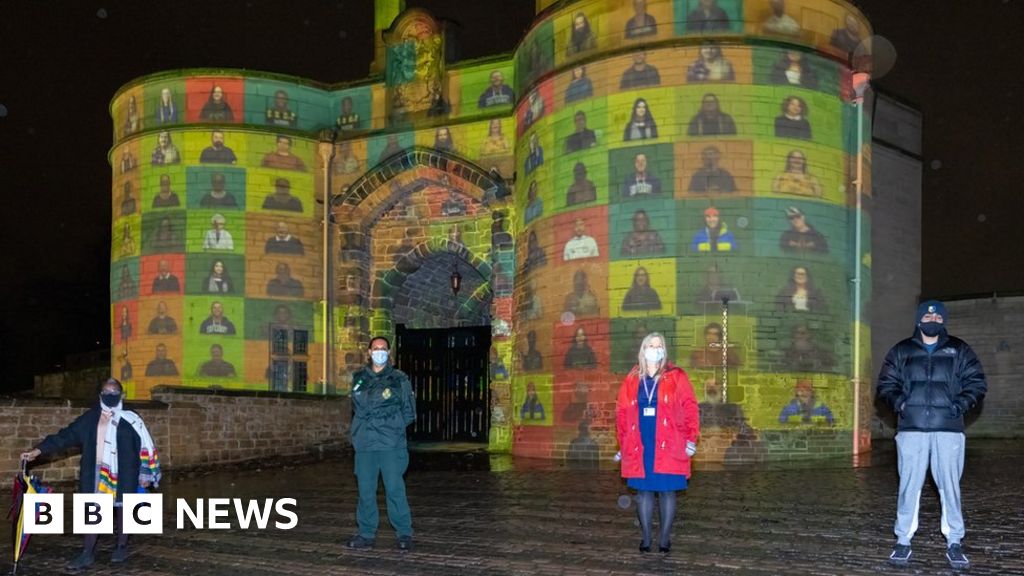 Nottingham Castle lights up walls with faces of residents - BBC News