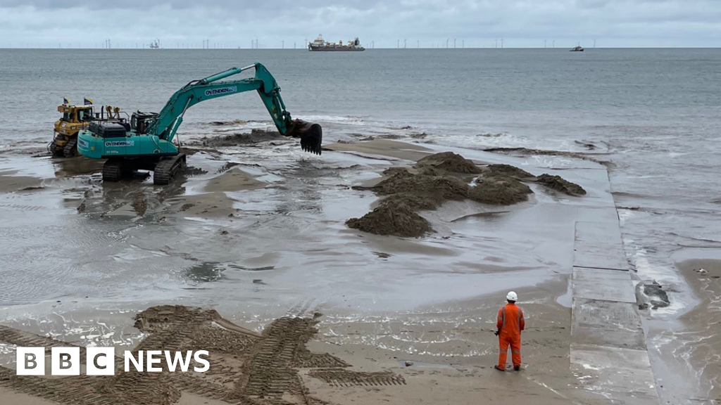 Sea defence: Million tonne Rhos on Sea sand move starts - BBC News