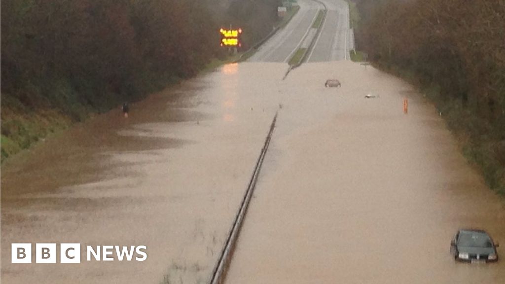 Homes evacuated and A5 and A55 shut in north Wales floods - BBC News