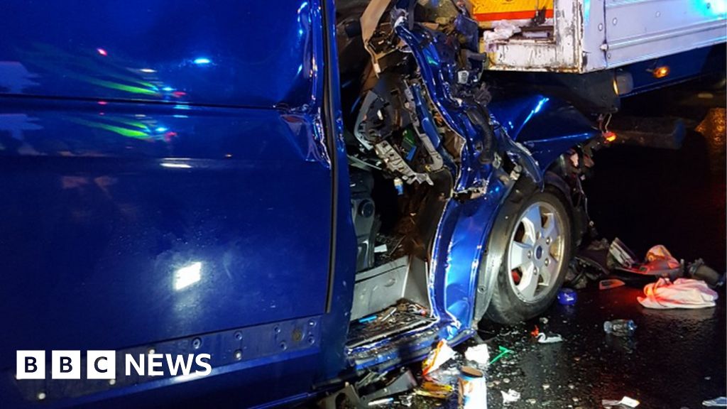 M6 crash van left 'embedded' under lorry - BBC News