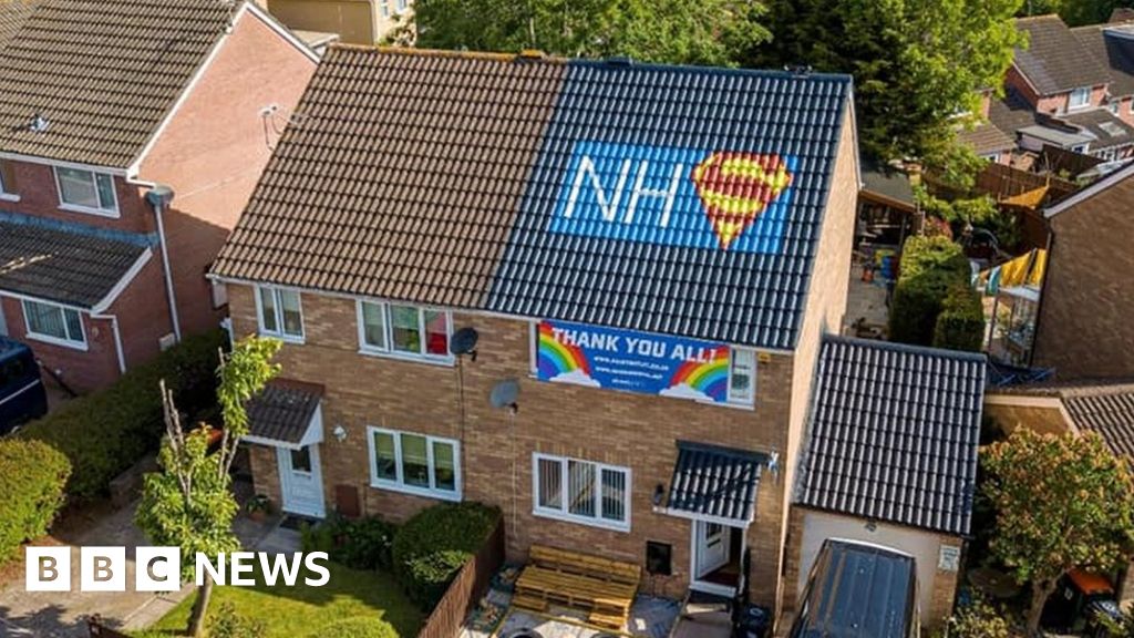 Coronavirus: Newport man's rooftop Superman tribute to NHS