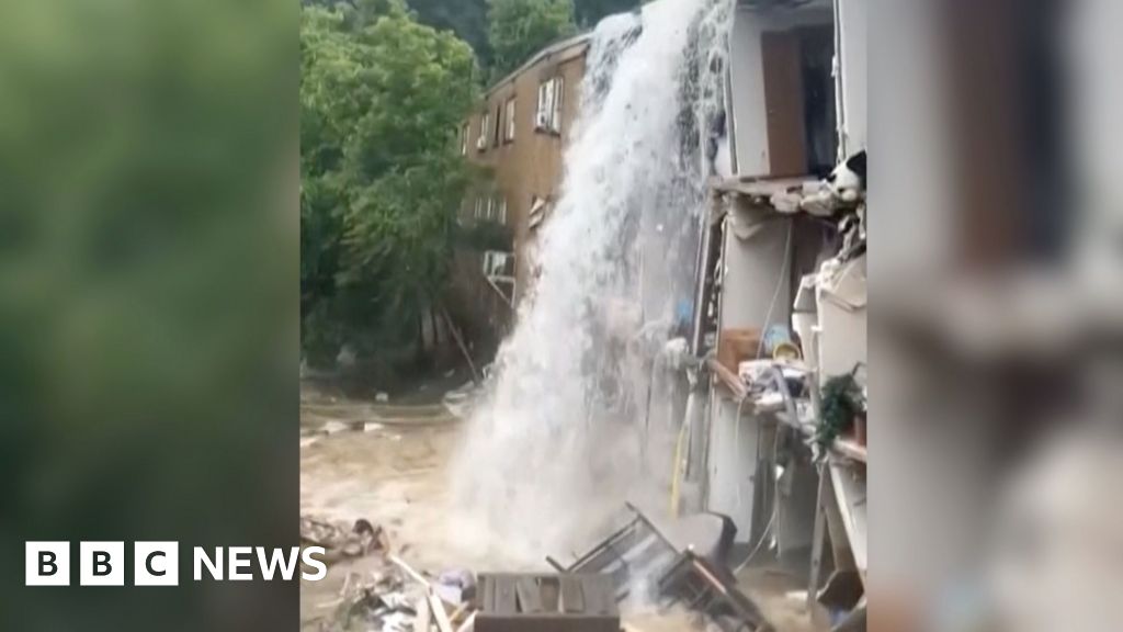 Houses and roads destroyed by flash flooding in West Virginia