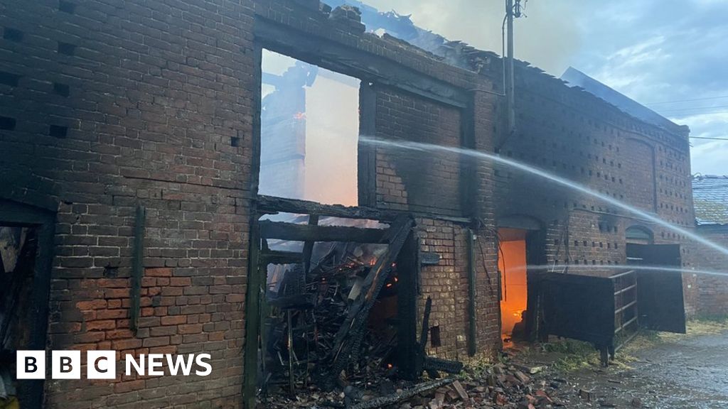 Dozens of firefighters tackle Shropshire barn fire - BBC News