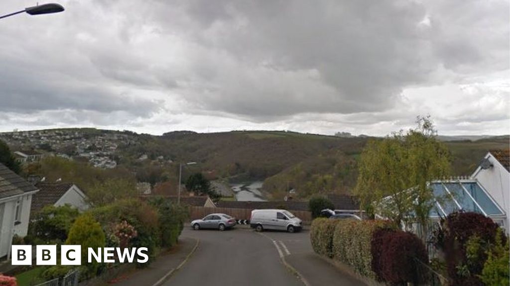 Looe crash: Girl dead as 'ice-slide' car hits house