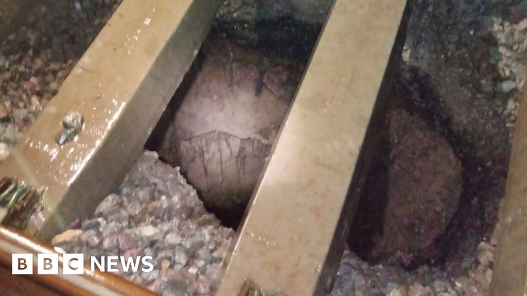 Rail line repaired after floods leave 6ft hole under track