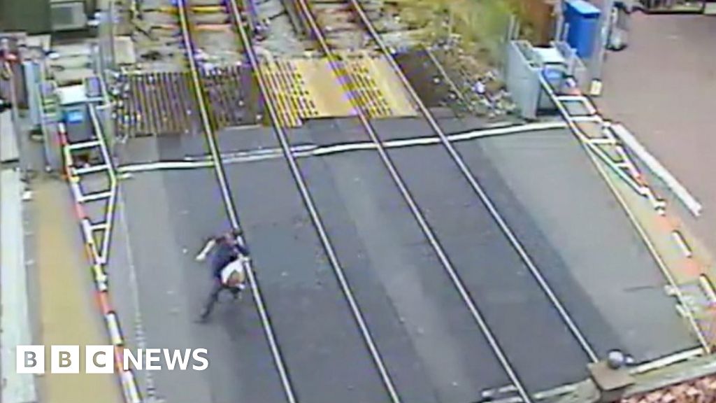 Poole level crossing video released to highlight dangers - BBC News