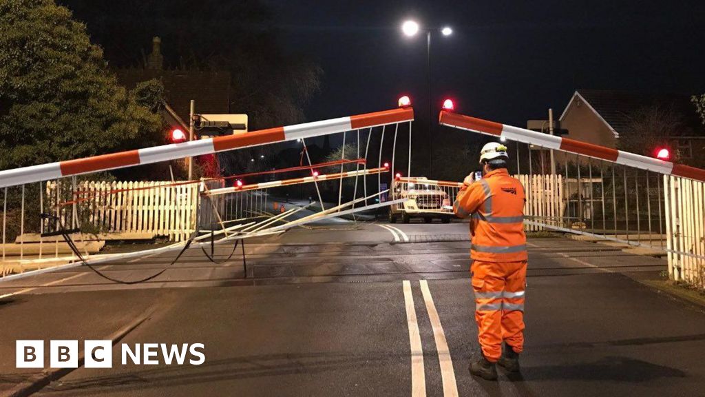 Coventry level crossing damaged after car hits barrier - BBC News