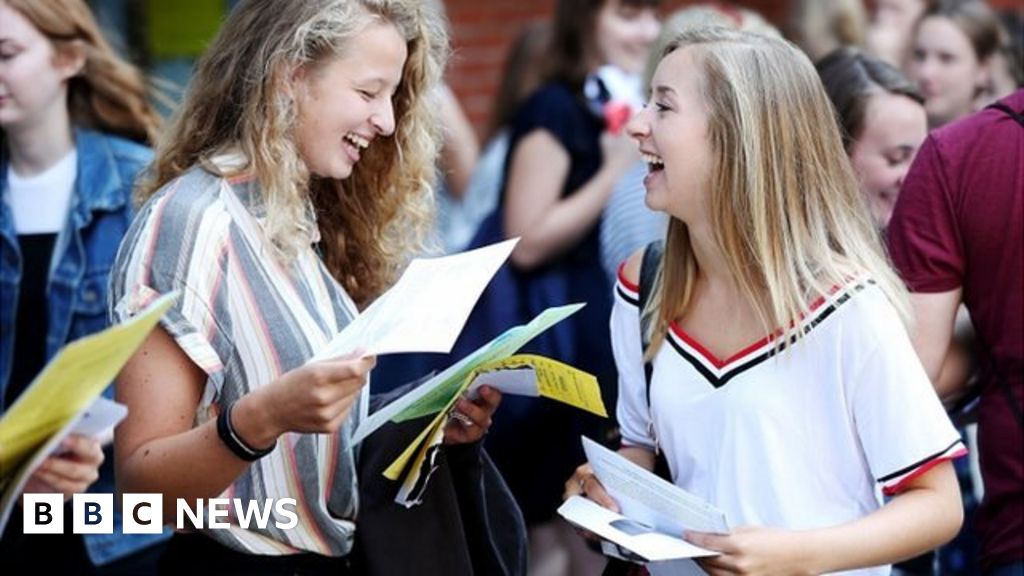 Record university offers as top A-level grades slip - BBC News