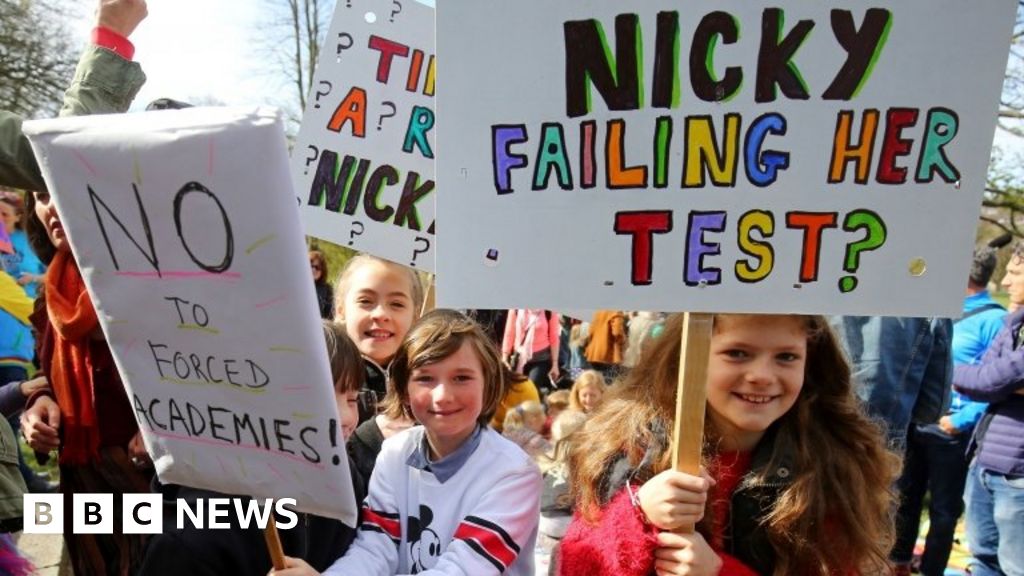 Parents keep children off school in test protest - BBC News