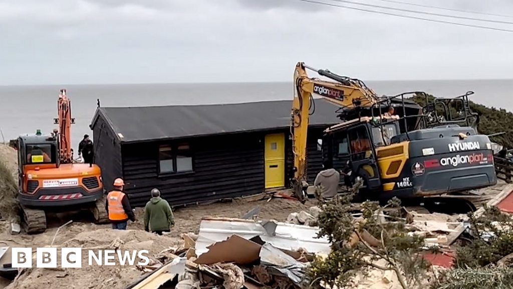 Hemsby home dragged back from crumbling cliff edge - BBC News
